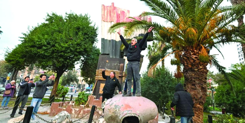 Syrians topple and trample on statues of Assad's father | The Asian Age ...